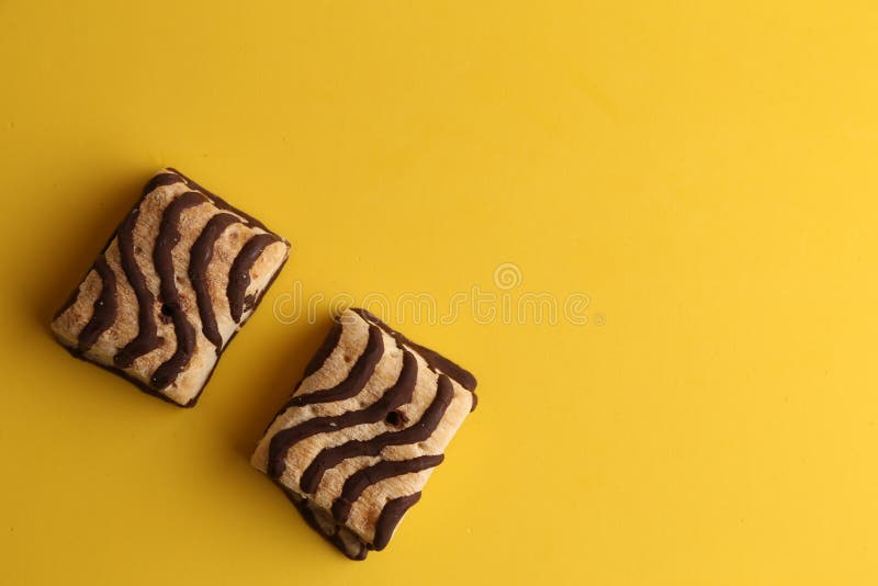 Top View of Two Delicious Biscuits on a Bright Yellow Surface Stock ...