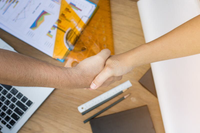 Top View of Two Engineer Shaking Hand on Wood Table with Tool an Stock ...