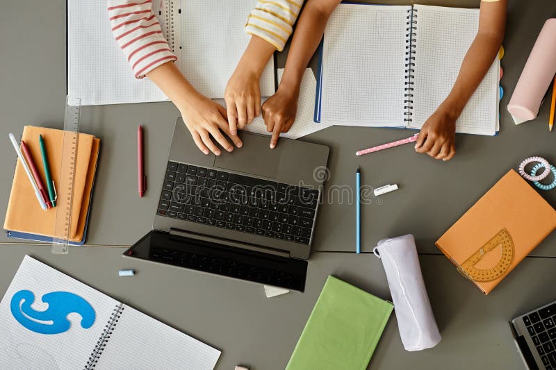 Top View of Two Kids Using Laptop while Studying at Table with ...