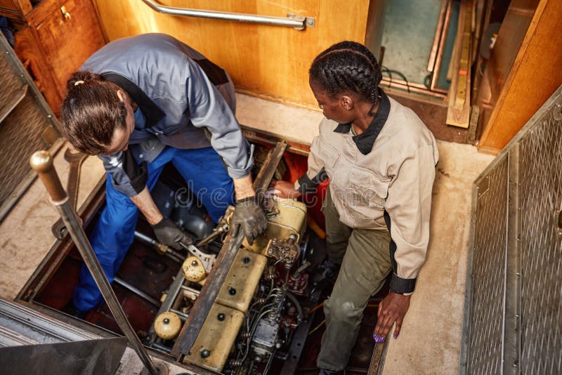 Top View Two People Repairing Boat Engine in Pit Stock Photo - Image of ...