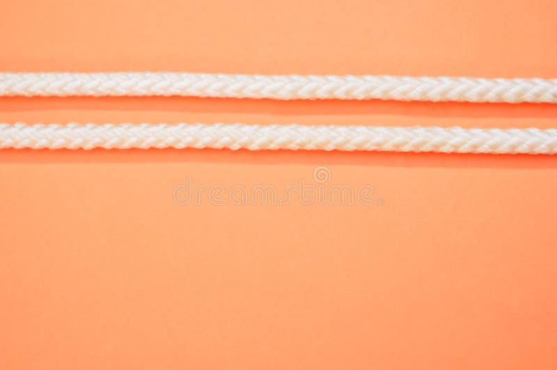 Top View of Two White Ropes Horizontally Isolated on the Pastel Orange ...