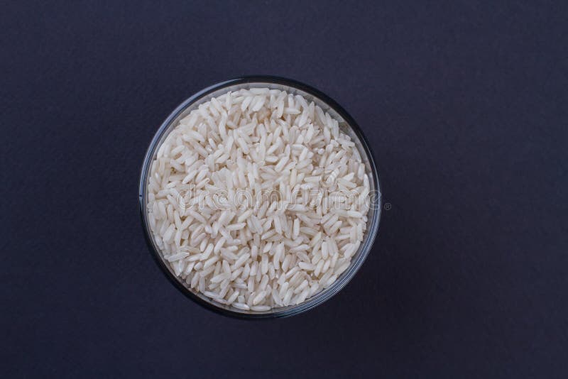Top View Uncooked Raw Rice in a Transparent Glass Cup. Stock Photo ...
