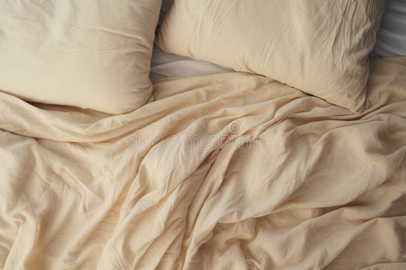 Top View of an Unmade Beige Bed with a Crumpled Sheet, Blanket and ...