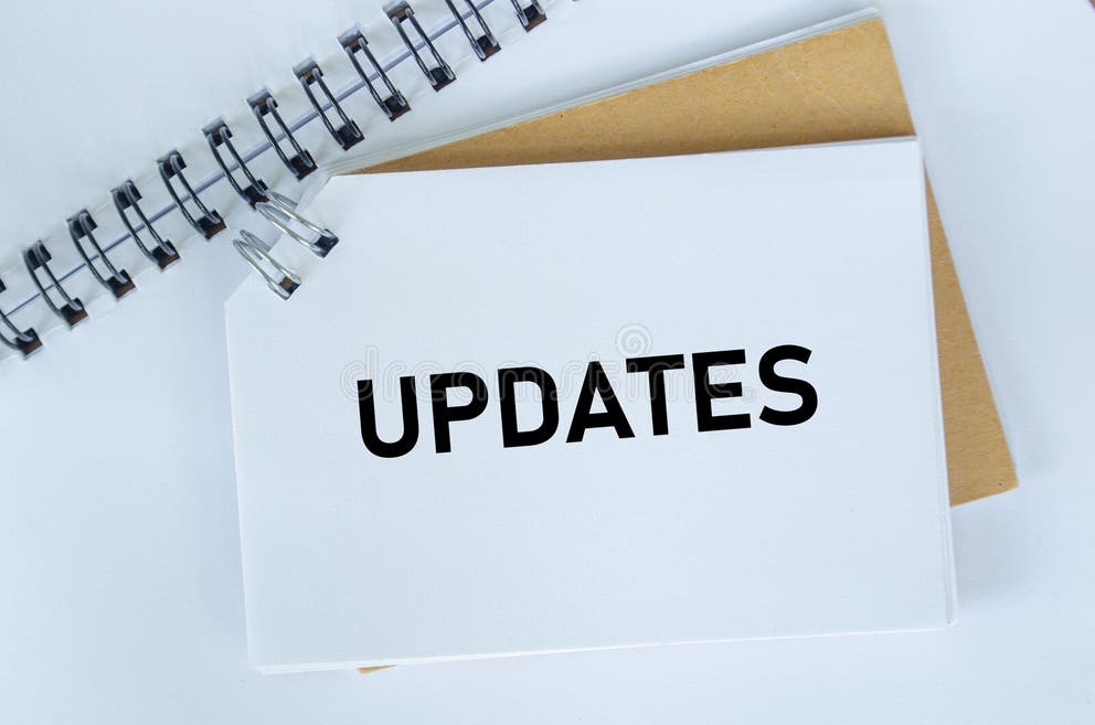 Top View of Updates Text on White Notepad. Business Update Concept ...