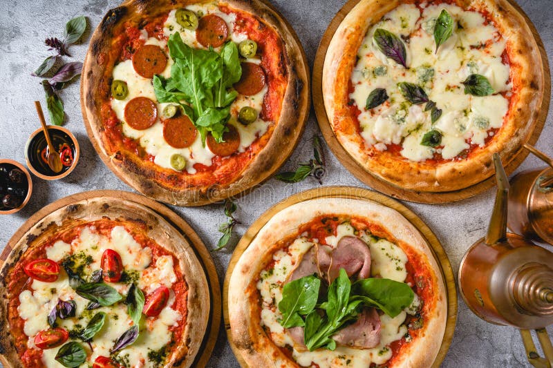 Top View of Various Neapolitan Pizzas on Grey Stone Table Stock Photo ...