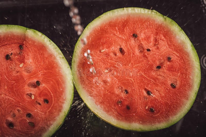 Top View of Water Dropping on Halved Red Delicious Watermelons Stock ...