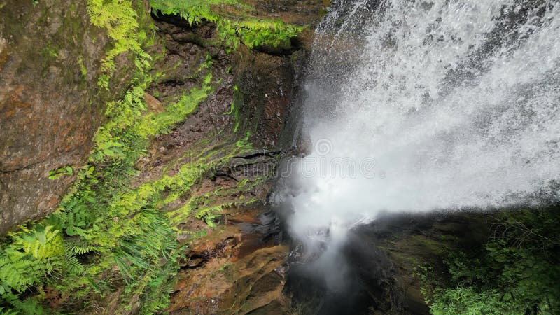 Top View of a Waterfall Flowing Down a Cliff with Greenery Stock ...