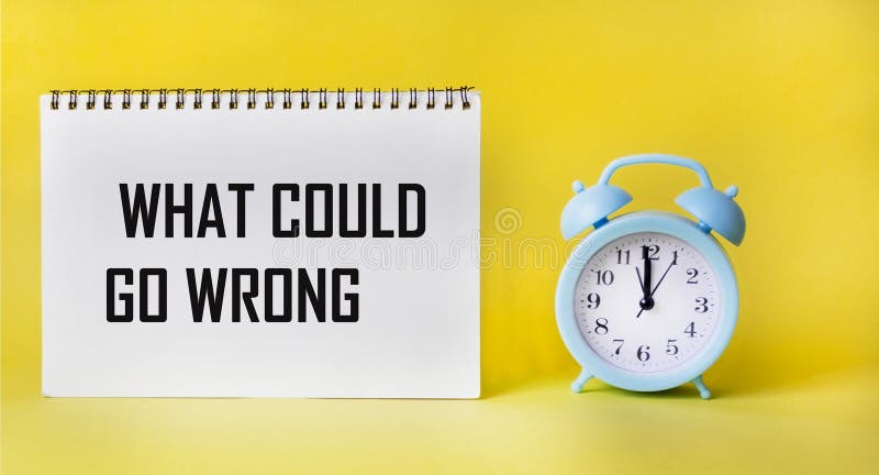 Top View of What Can Go Wrong, Text on Notepad and Yellow Background ...