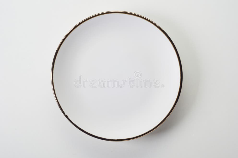 Top View of a White Ceramic Flat Plate with a Black Rim on a White ...