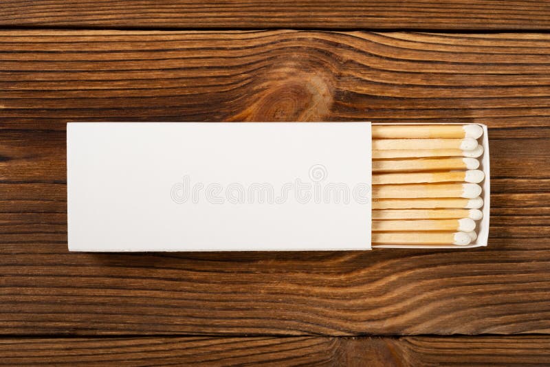 White Color Matchbox with White Match Sticks on a Wood Table Stock ...