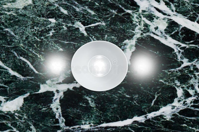 Top View of White Deep Small Plate on a Dark Marble Table Surface in ...
