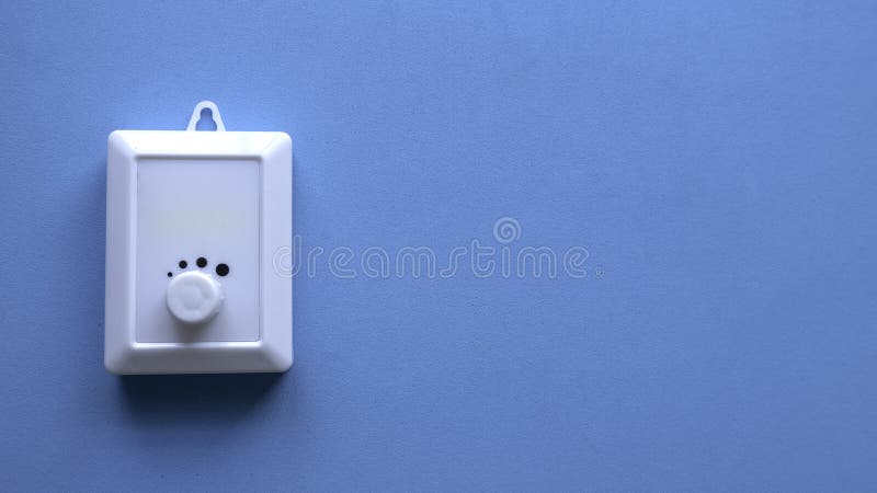 Top View of a White Dimming Light on a Blue Background with Copy Space ...