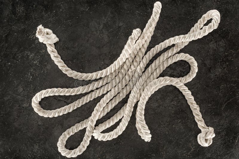 Top View of White Nautical Rope with Knots on Dark Stock Photo - Image ...