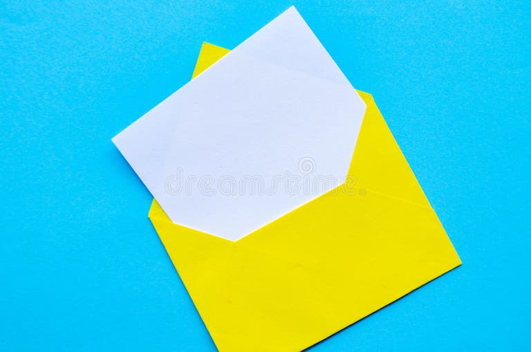 Top View of White Notepad with Envelope on Blue Cover Background with ...