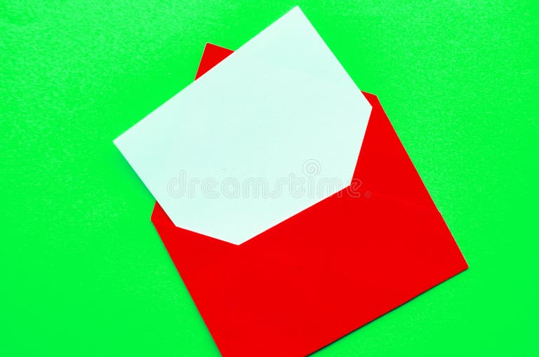 Top View of White Notepad with Envelope on Green Cover Background with ...