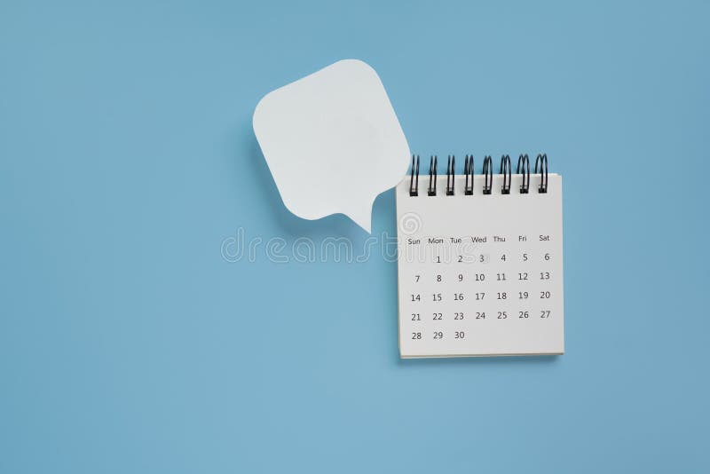 Opened White Calendar with Real Blank White Speech Bubble Paper on Blue ...
