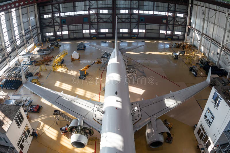 Top View of a White Passenger Jet Plane in the Aviation Hangar ...