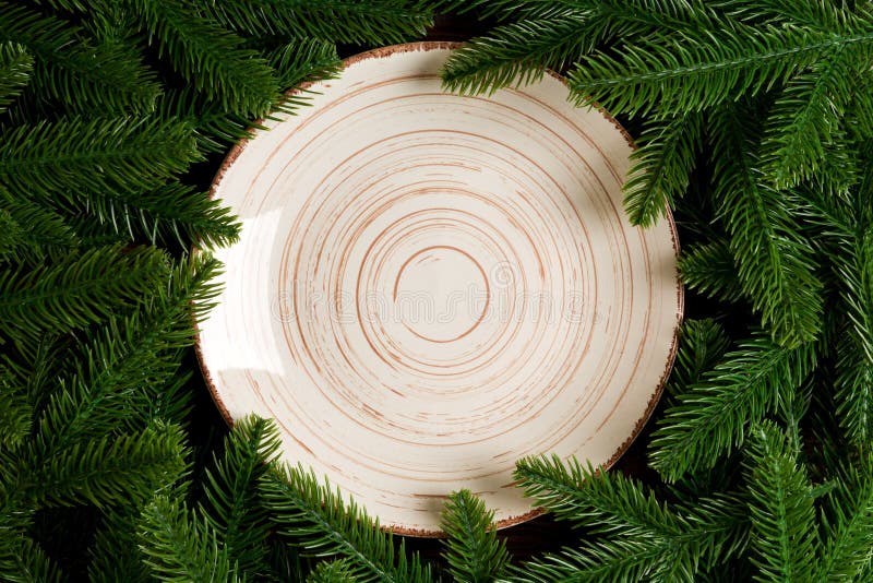 Top View of White Plate Surrounded with Fir Tree Branches. Christmas ...