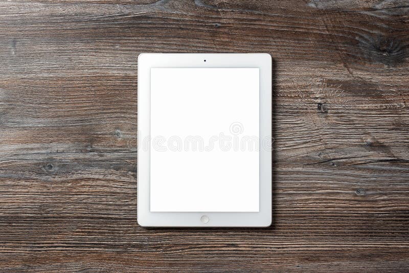 Top View of a White Tablet Lying on a Beautiful Wooden Table Stock ...