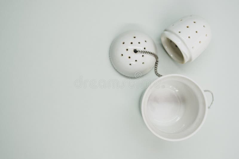 Top View of a White Tea Strainer with an Infuser Isolated on a Gray ...