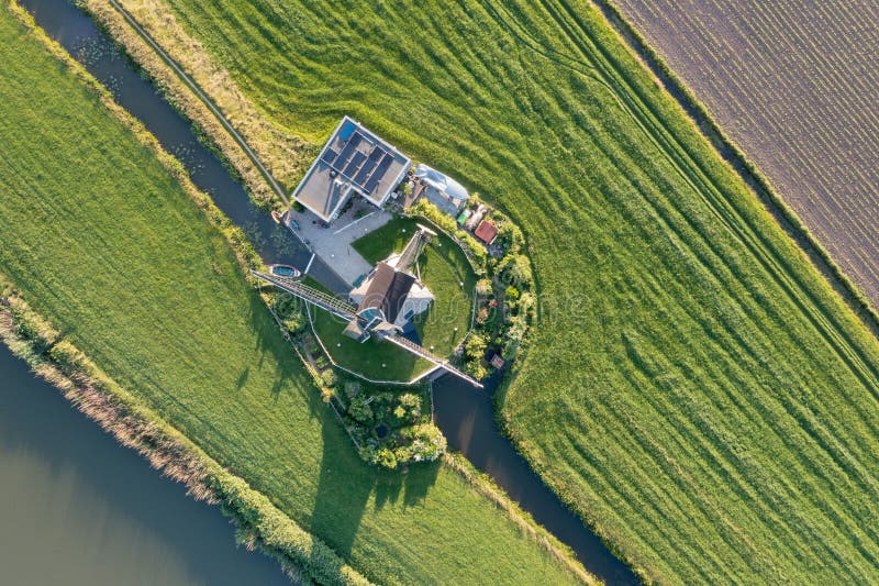 Top View of a Windmill in the Middle of Farm Fields Early in the ...