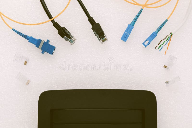 Top View of a Wireless Router with Various Patch Cords on a White ...