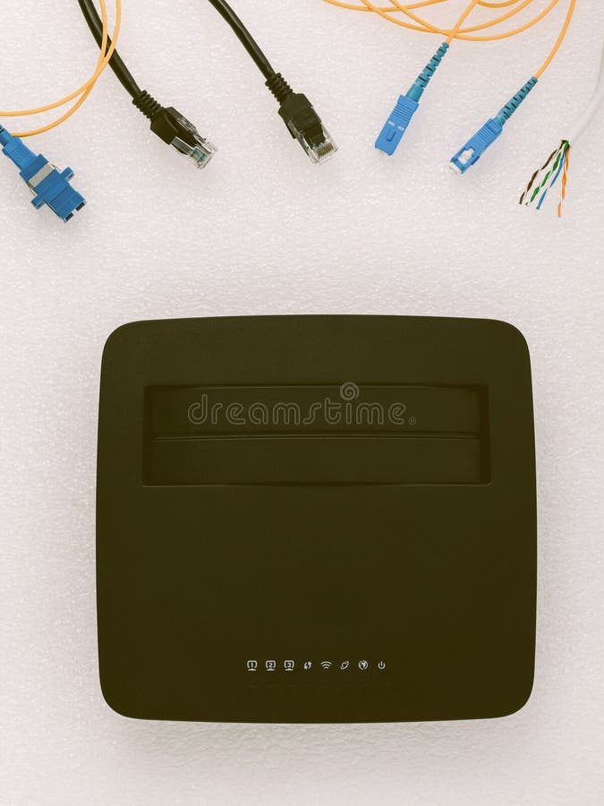 Top View of a Wireless Router with Various Patch Cords on a White ...