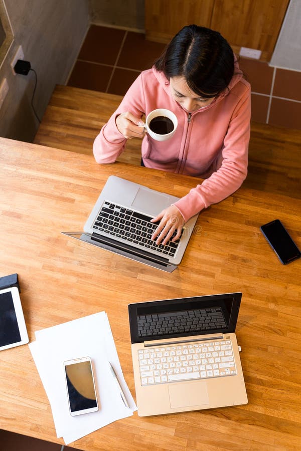 Top View of Woman Drink of Coffee when Using the Laptop Computer Stock ...