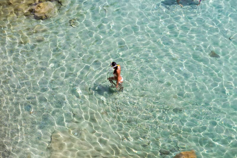 Top View of Woman Getting Out of the Water at Milos, in Greece Stock ...