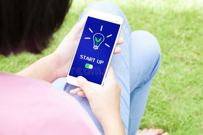 Top View of Woman Using Her Mobile Phone with Start Up Icon. Stock ...
