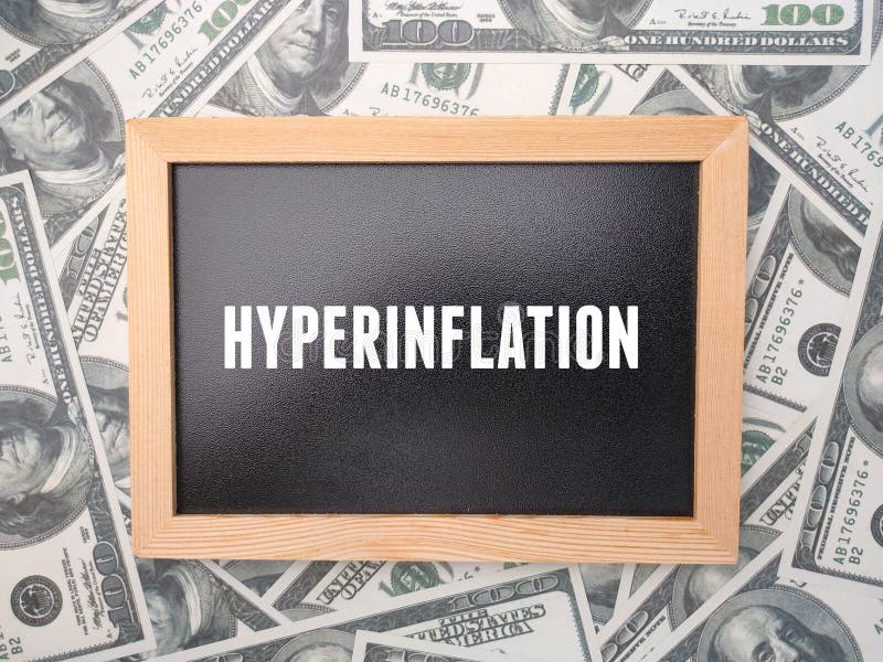 Wooden Board and Banknotes with the Word HYPERINFLATION. Stock Photo ...
