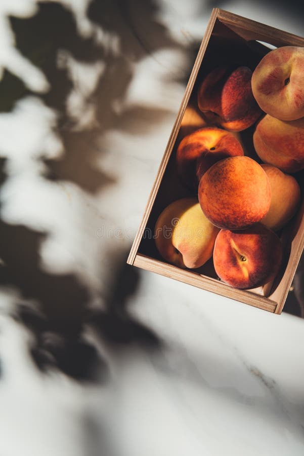Top View of Wooden Box Full of Fresh Peaches on Light Marble Surface ...
