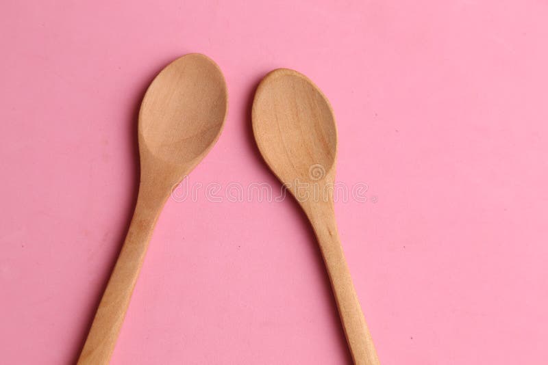 Top View of the Wooden Spatulas on the Pink Background Stock Photo ...