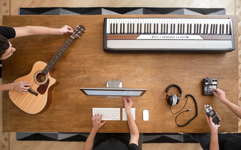 Top View of a Wooden Table with Musical Instruments and a Computer ...