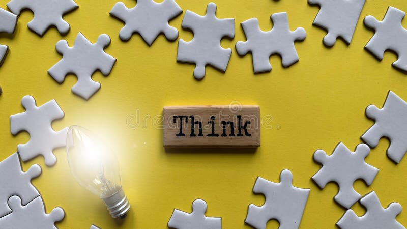 Top View of Word - Think. with Jigsaw Puzzle and Bulb Background Stock ...