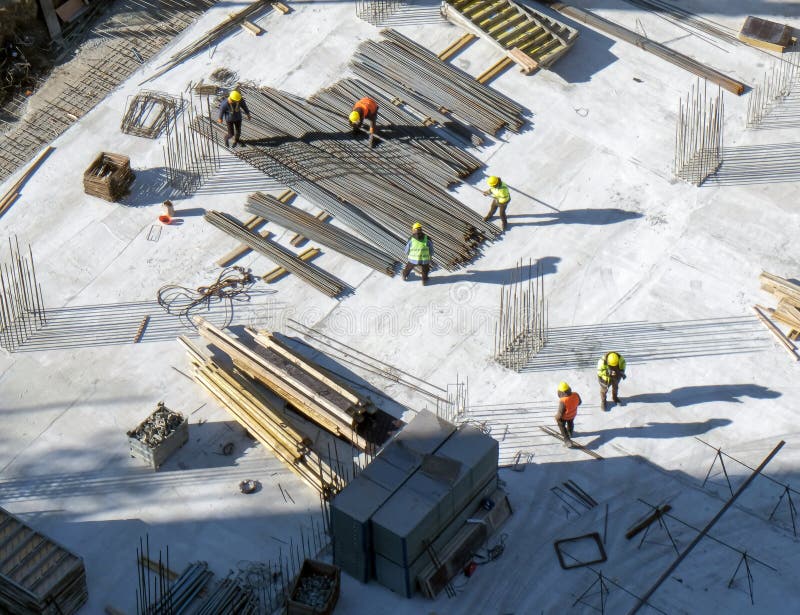 Top View: Workers Doing Job with a Metal Rebars at the Construction ...