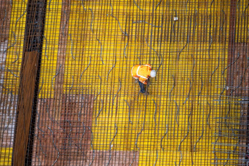 Top View of Workers Preparing a Concrete Foundation Plate at a ...