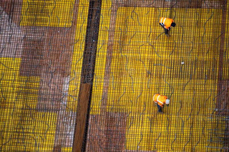 Top View of Workers Preparing a Concrete Foundation Plate at a ...
