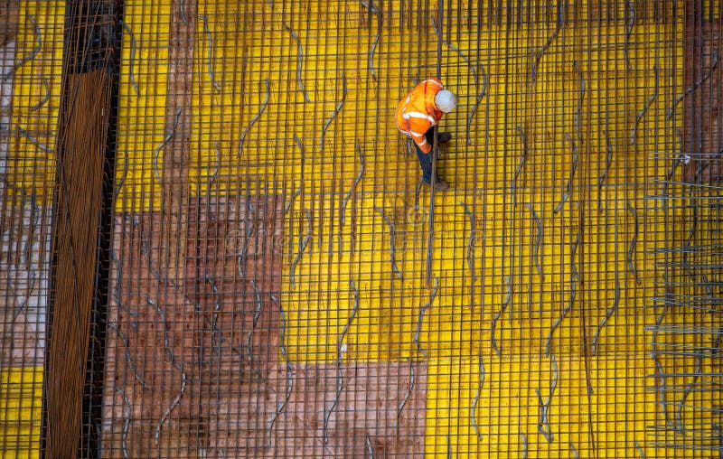 Top View of Workers Preparing a Concrete Foundation Plate at a ...