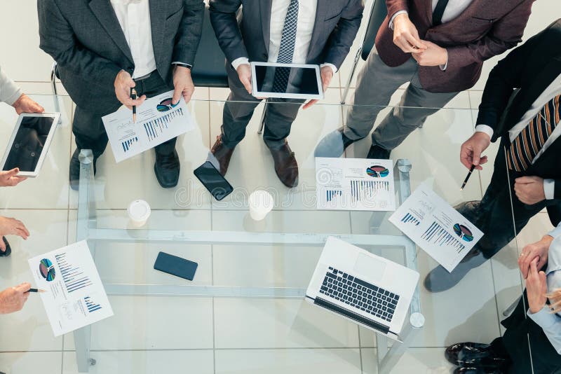 Top View. Working Group with Financial Documents Discussing a New ...