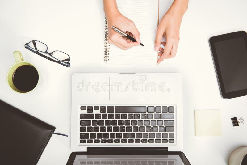 Top View of Working Table with Woman Hand Writing Notebook Stock Photo ...
