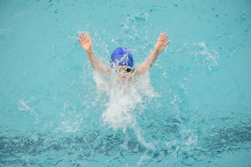 7-year Boy Swimming Backstroke in a Swimming Pool Stock Photo - Image ...