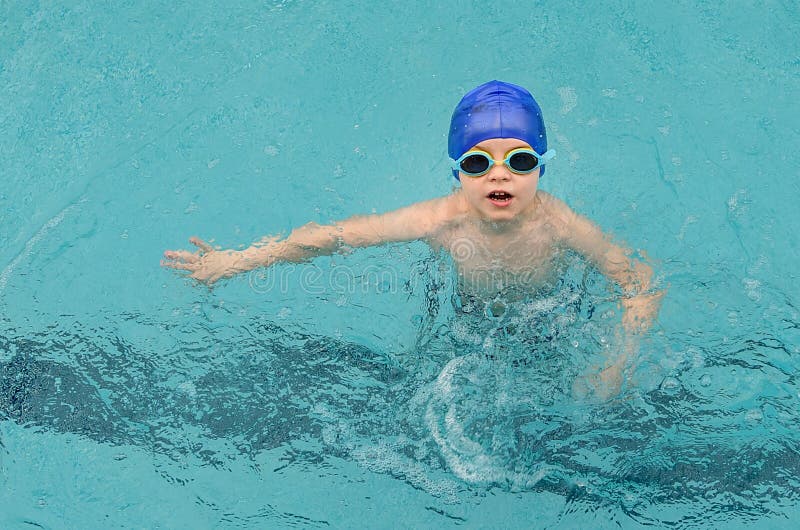 7-year Boy Swimming Backstroke in a Swimming Pool Stock Photo - Image ...