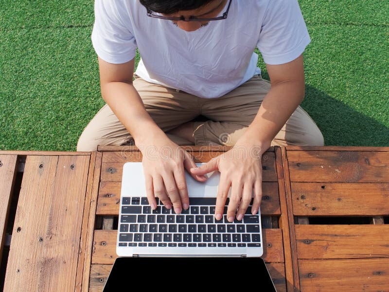 Top View of Young Asian Man Using Computer Laptop at Outdoors. Stock ...