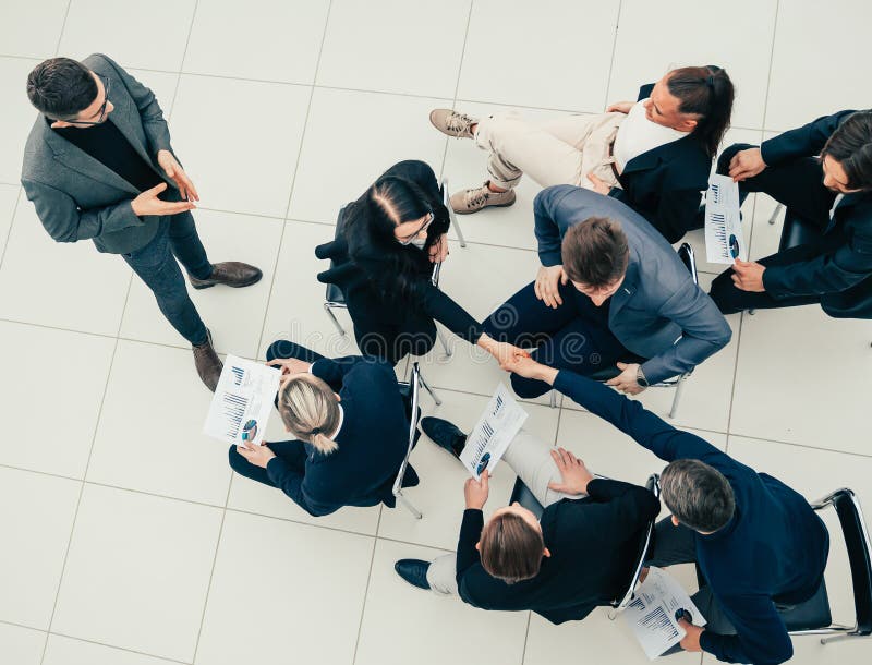 Young Employees Supporting Each Other with a Handshake. Stock Image ...