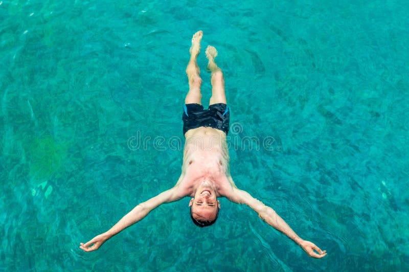 Top View of a Young Man Floating in Swimming Pool with Open Arms Stock ...