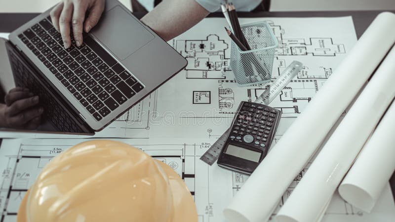 Top View, Young Man with a Laptop Plotting a System of Building ...