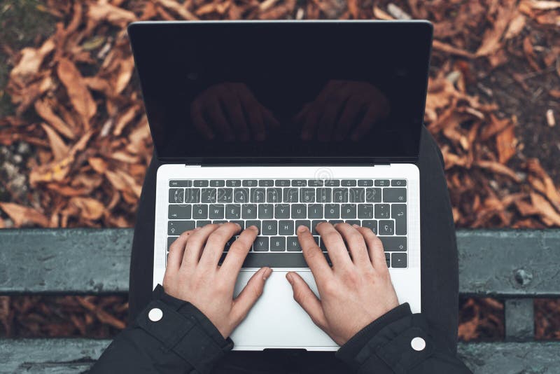 Top View, of Young Man Sitting on Park Bench on Autumn with Laptop ...
