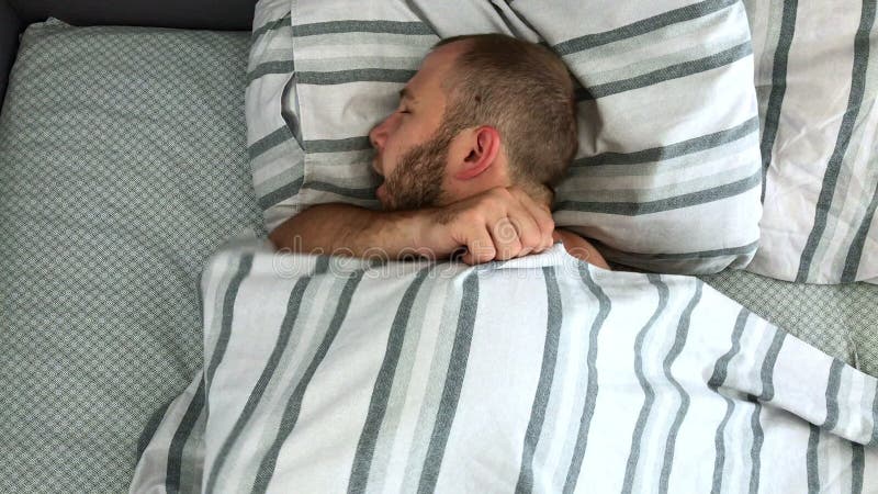 Top View of Young Man is Sleeping in the Bed. Stock Footage - Video of ...