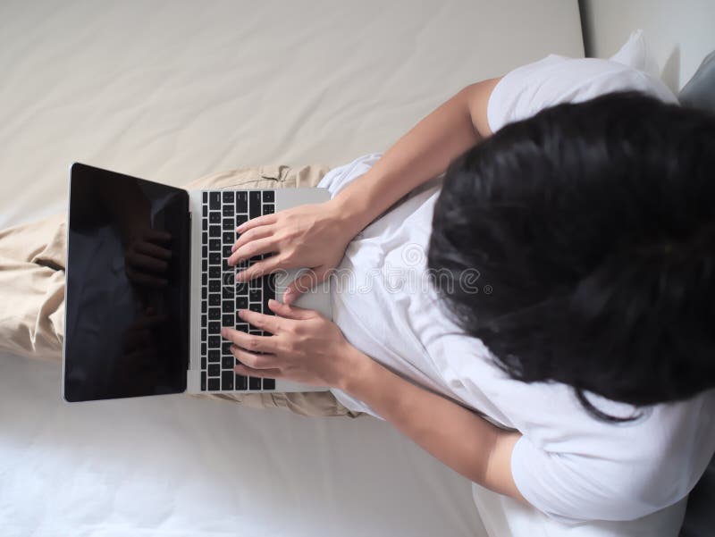 Top View of Young Man Using Computer Laptop on the Bed in Bedroom Stock ...